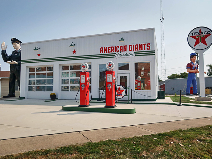The American Giants Museum stands proudly in Atlanta, Illinois, where vintage gas pumps and a waving policeman giant welcome roadtrippers to this Route 66 treasure.