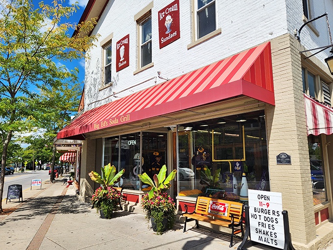 That iconic red awning isn't just a sunshade&mdash;it's a time portal to an era when conversations happened face-to-face and milkshakes required both hands.