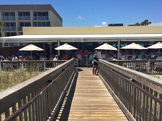 The unassuming entrance to Shuckers belies the seafood treasures within. Florida dining at its most authentic&mdash;no pretense, just promise.