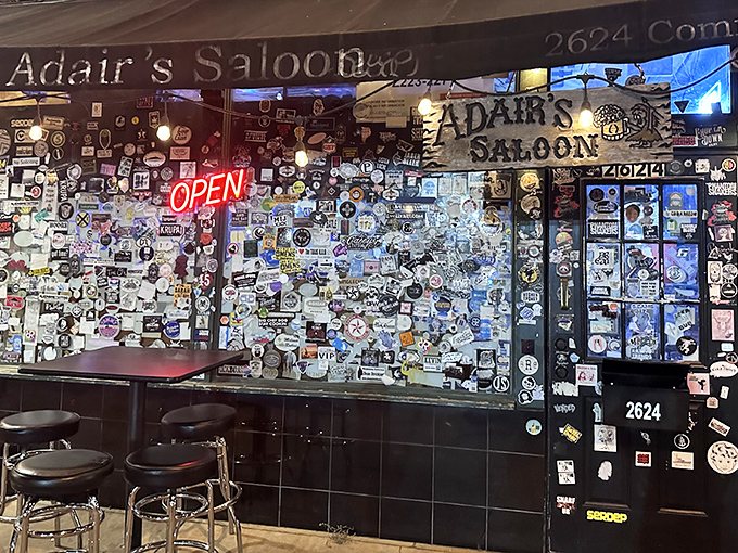 Sticker shock takes on new meaning at Adair's entrance, where decades of patron-applied memorabilia create a visual history more authentic than any designer could dream up.