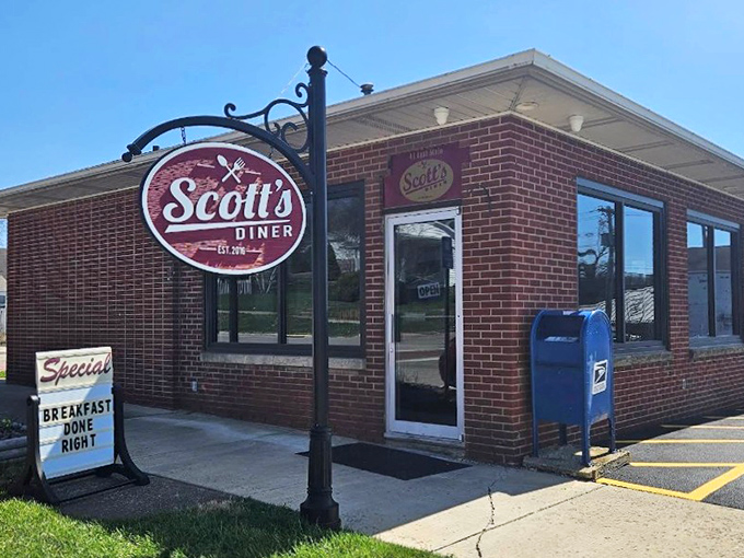 That hanging sign might as well say "Happiness This Way" &ndash; Scott's Diner's exterior is the culinary equivalent of a warm handshake.