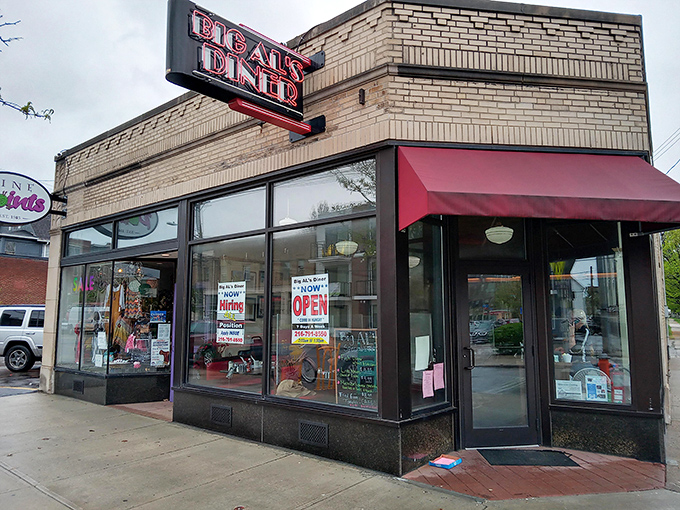 The unassuming brick exterior of Big Al's Diner stands like a time capsule on Larchmere Boulevard, its burgundy awning a beacon for breakfast enthusiasts.