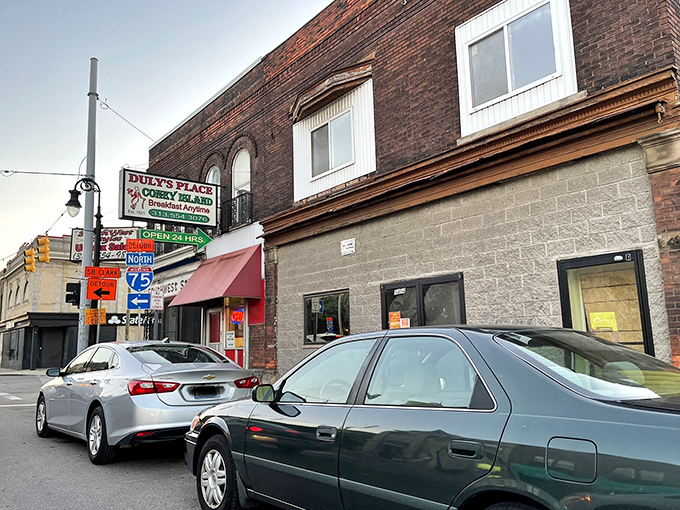 The unassuming brick exterior of Duly's Place stands as a Detroit landmark, where coney dreams come true regardless of the weather outside.