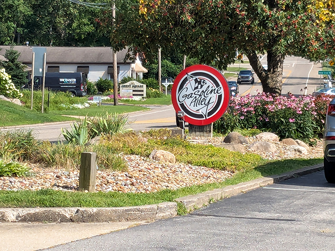 The iconic Gasoline Alley sign welcomes hungry travelers like a beacon of comfort food hope amid Bath's scenic landscape.
