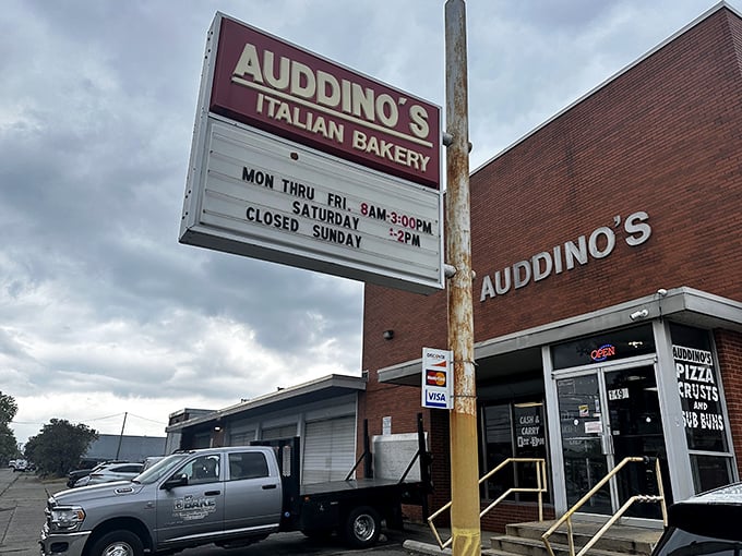That classic red sign promises Italian baking magic within&mdash;operating hours that smart locals have memorized like their own birthdays.