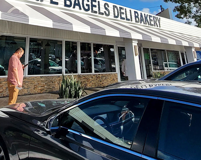 The classic striped awning of Grampa's beckons like a lighthouse for hungry souls seeking authentic deli salvation in Dania Beach.