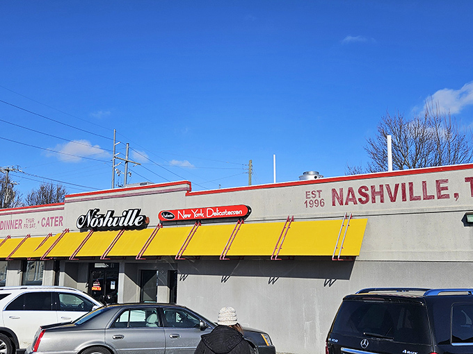 The bright yellow awning of Noshville beckons like a taxi in Manhattan, promising authentic deli delights in the heart of Nashville.