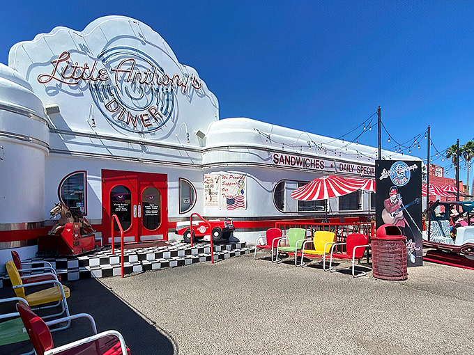 Those colorful metal chairs aren't just seating—they're front-row tickets to the greatest show in Tucson: watching classic cars roll up while you debate between a milkshake or malt.
