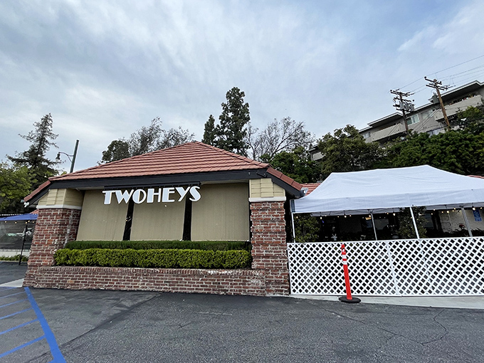 The iconic Twohey's exterior welcomes hungry patrons with its classic brick fa&ccedil;ade and mid-century charm &ndash; a culinary time machine waiting to transport you.