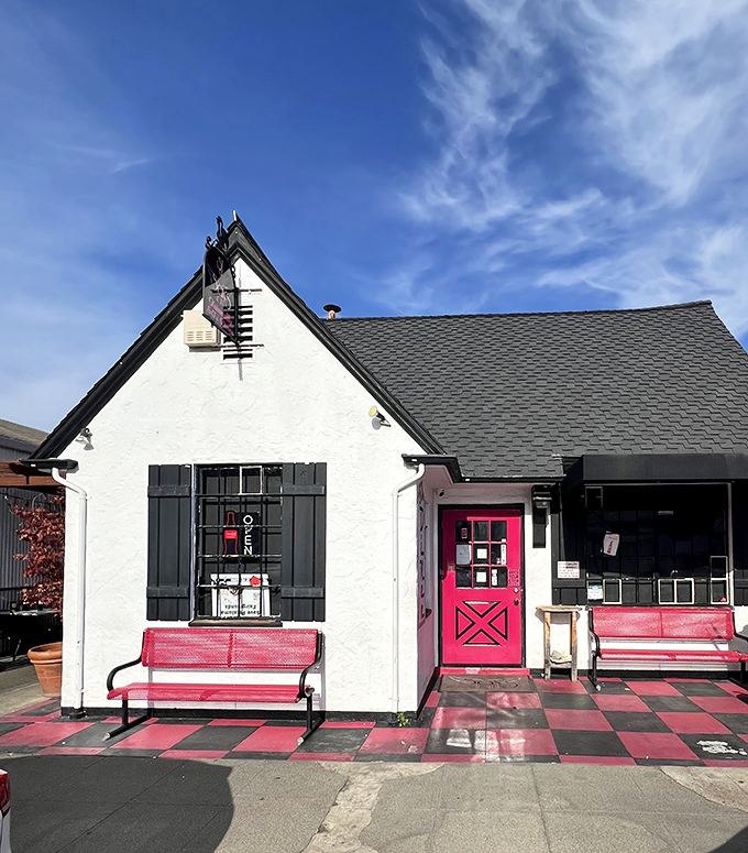 With its storybook cottage vibe and checkerboard curb appeal, this diner looks ready to serve nostalgia hot.