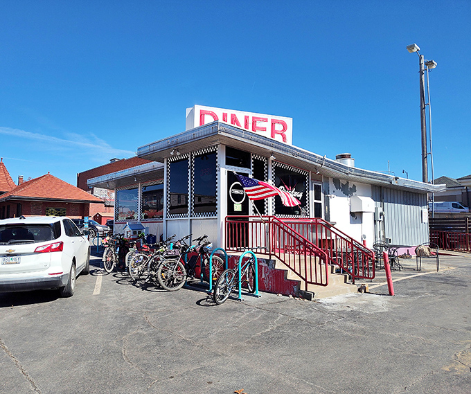 The iconic red neon "DINER" sign stands out against the blue Missouri sky, a beacon calling hungry souls to breakfast paradise.