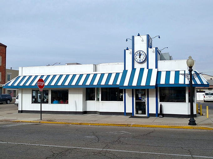 That iconic blue and white striped awning isn't just eye-catching—it's a time portal to when breakfast was king and calories weren't counted.