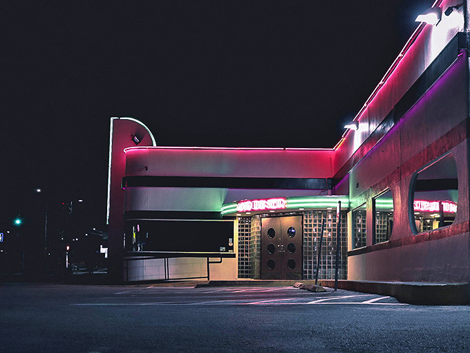 The unassuming white exterior of 410 Diner stands like a time capsule of Americana, promising comfort food treasures within those curved retro windows.