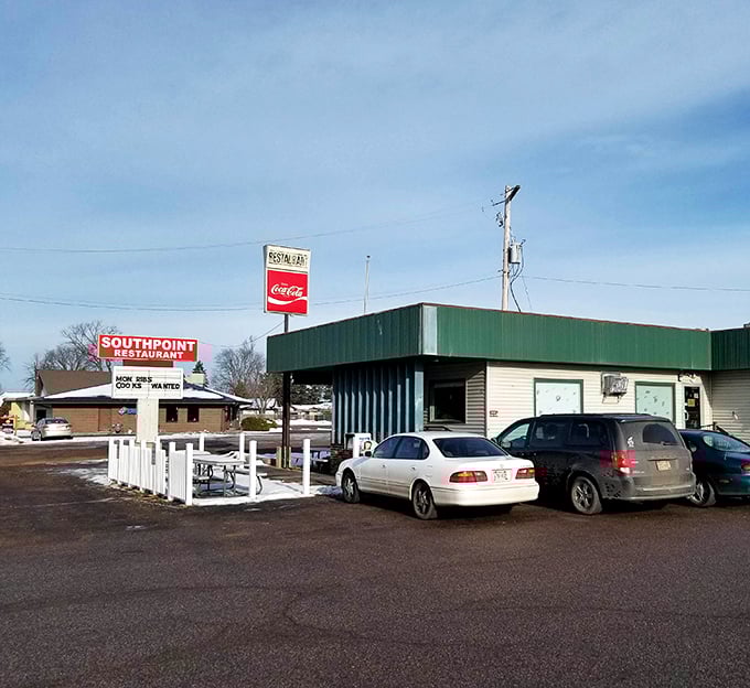 The classic green awning and white picket fence of South Point Restaurant stand as a beacon of comfort food in Stevens Point.