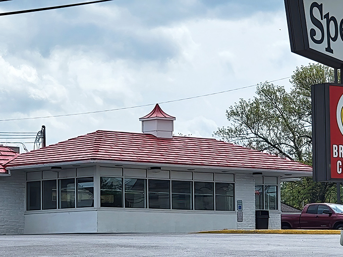 The iconic red-striped roof of Speck's Drive-In stands as a beacon of hope for fried chicken enthusiasts everywhere. Time travel has never been so delicious. 