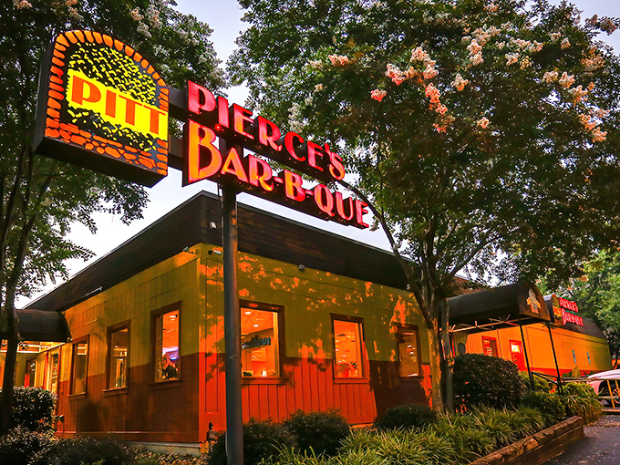 That iconic neon sign has guided hungry travelers to smoky paradise since bell-bottoms were unironically cool.