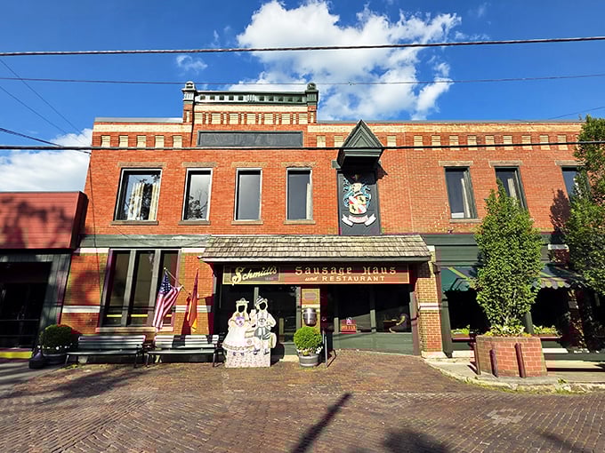 The brick facade of Schmidt's Sausage Haus stands like a delicious time portal to old-world Germany, complete with seasonal decorations that say "Willkommen, hungry friends!"