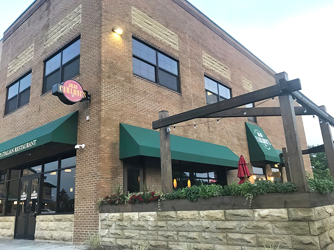 The brick exterior of Jo Jo Carloni's welcomes you with its distinctive green awnings&mdash;like an Italian grandmother beckoning you in for Sunday dinner.