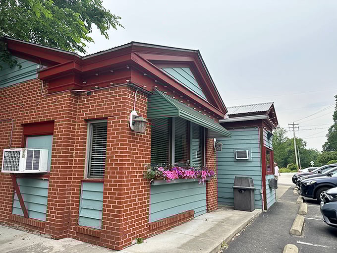 The unassuming exterior of Gasoline Alley hides culinary treasures within, like finding a Picasso at a yard sale. Those flower boxes add a homey touch to this automotive-themed gem.
