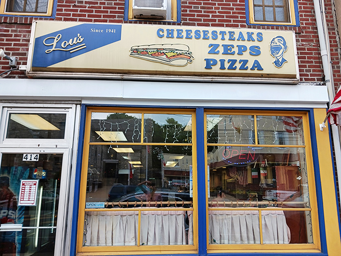 Lou's iconic blue and yellow storefront has been beckoning sandwich lovers to Norristown since 1941. Cheesesteaks, Zeps, and Pizza&mdash;the holy trinity of Pennsylvania comfort food.