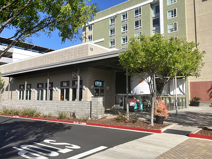 The modern exterior of Rok Steakhouse & Grill beckons hungry travelers with promises of sizzling volcanic adventures within.