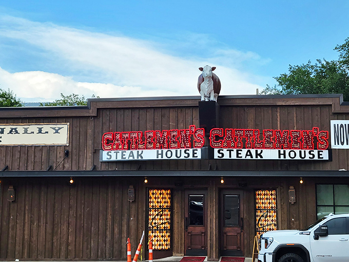 That neon glow against the Texas sky isn't just advertising&mdash;it's a promise of carnivorous delight waiting inside those wooden doors.