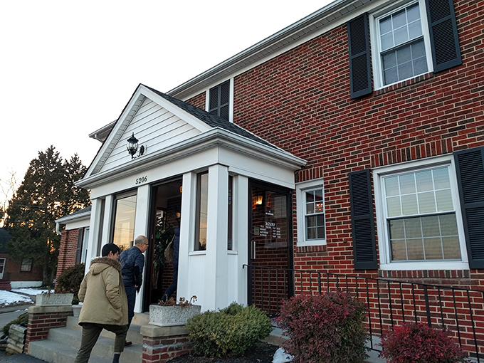 The stately brick exterior of Coach & Four stands like a culinary time capsule, promising old-school elegance before you even step through the door.