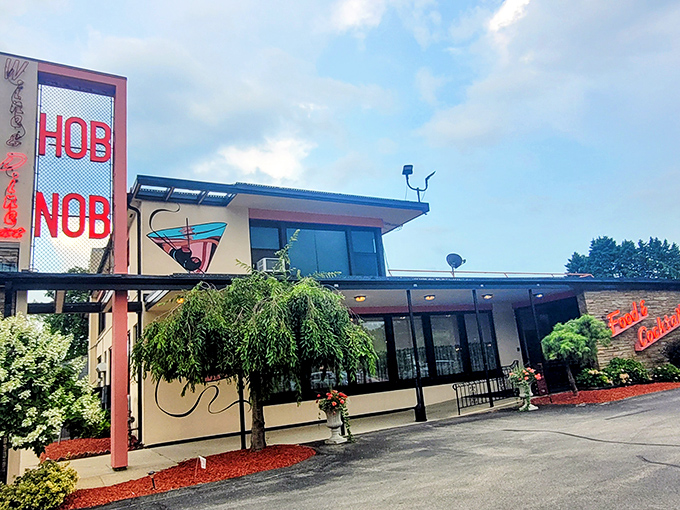 Mid-century charm meets lakeside elegance at HOBNOB's exterior, where the martini glass logo promises good times ahead.