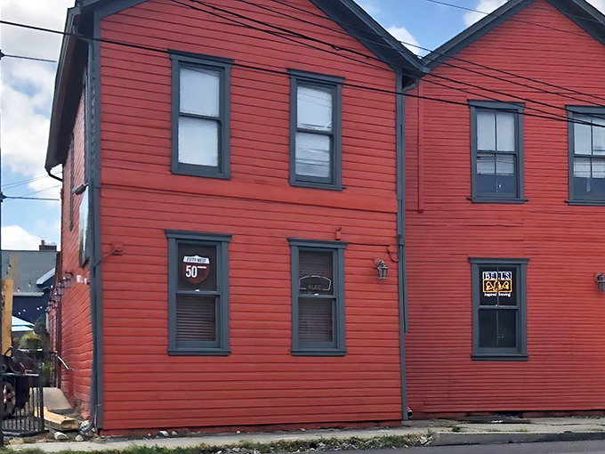 The rust-red exterior of South Park Pizza Tavern stands like a culinary sentinel in Dayton, promising comfort food without pretension or apology.