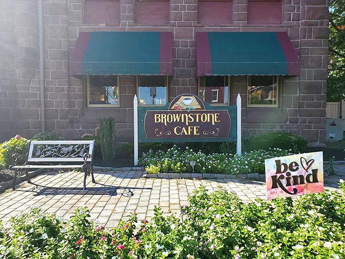 That charming brownstone exterior whispers "comfort food sanctuary" louder than any flashy billboard ever could.