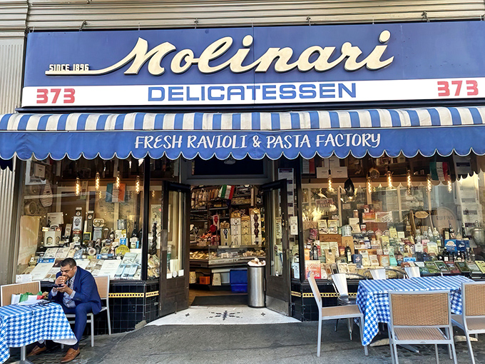 The iconic blue and white awning of Molinari's stands as a beacon of sandwich salvation in North Beach, promising Italian delights that transcend time.