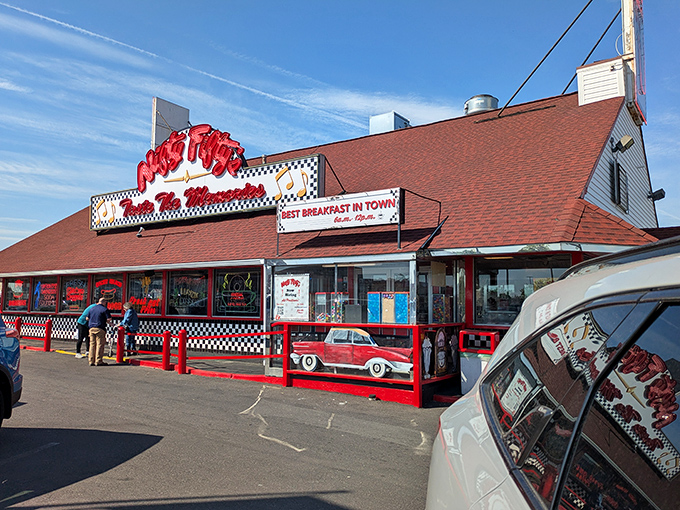 The classic red and white exterior of Nifty Fifty's stands like a beacon of nostalgia, promising comfort food that'll make your cardiologist wince and your taste buds sing.