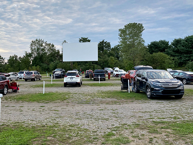Cars lined up under the twilight sky, a perfect tableau of Americana where memories are made one frame at a time.