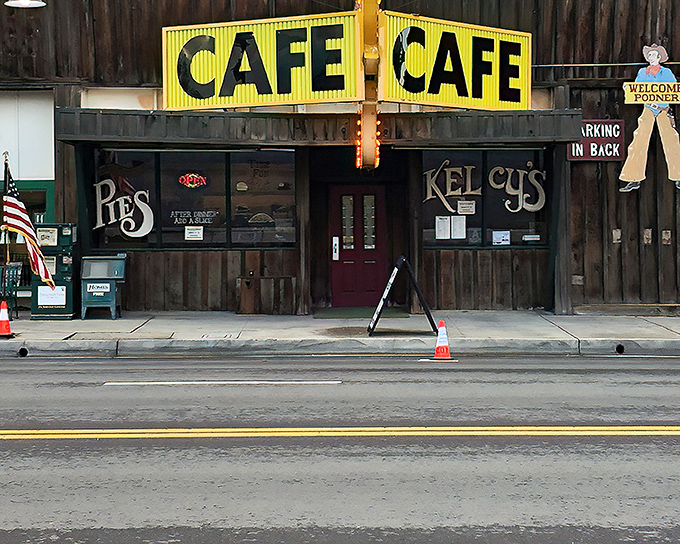The iconic yellow "CAFE" sign above Kelcy's wooden facade isn't just advertising &ndash; it's a beacon of hope for hungry travelers and locals alike.