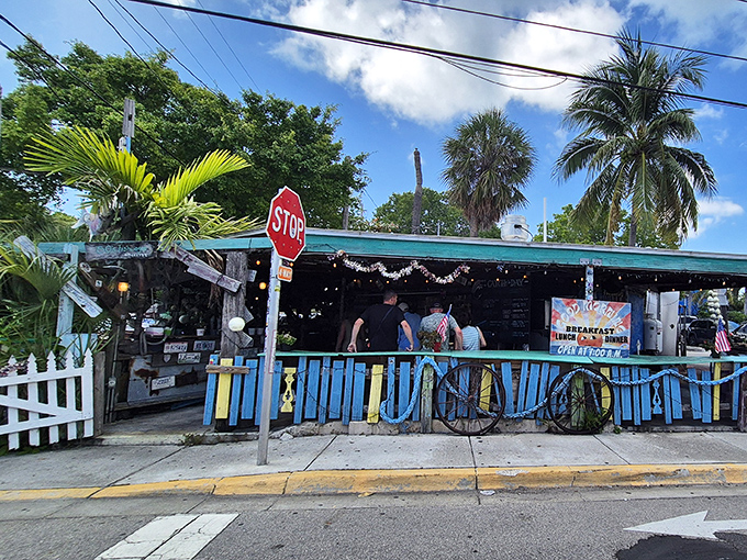 Where the sidewalk meets seafood paradise. That blue fence isn't keeping people out&mdash;it's barely containing all the flavor waiting inside.