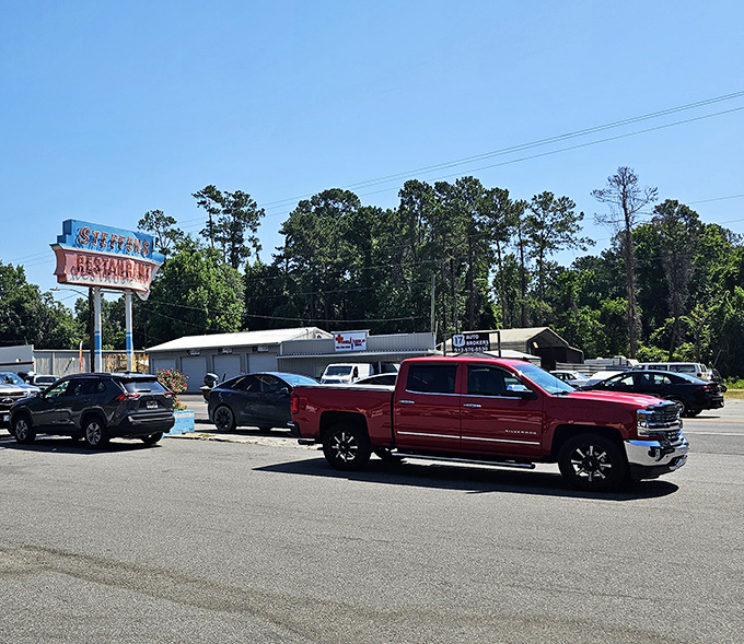 The unassuming exterior of Steffens Restaurant proves once again that culinary treasures often hide behind modest facades. Those orange-trimmed windows are practically winking at you.