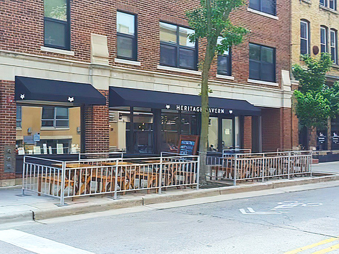 By day, Heritage Tavern's understated elegance beckons passersby with the promise of farm-to-table delights and a patio perfect for people-watching.