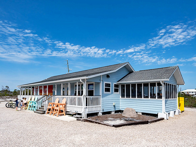The quintessential Florida seafood shack dream – pale blue siding, white porch railings, and the promise of Gulf treasures within. Beach bikes parked outside suggest the perfect post-swim meal spot.