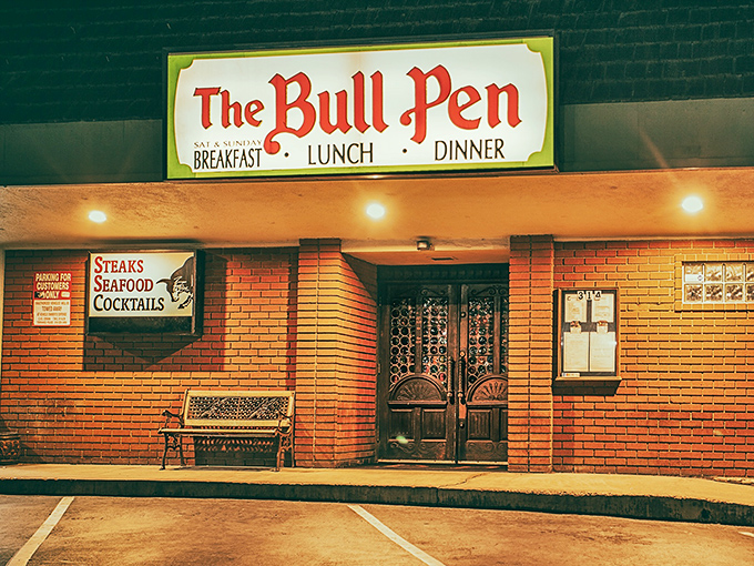 The Bull Pen's brick facade whispers promises of comfort food and cold drinks on warm California evenings.