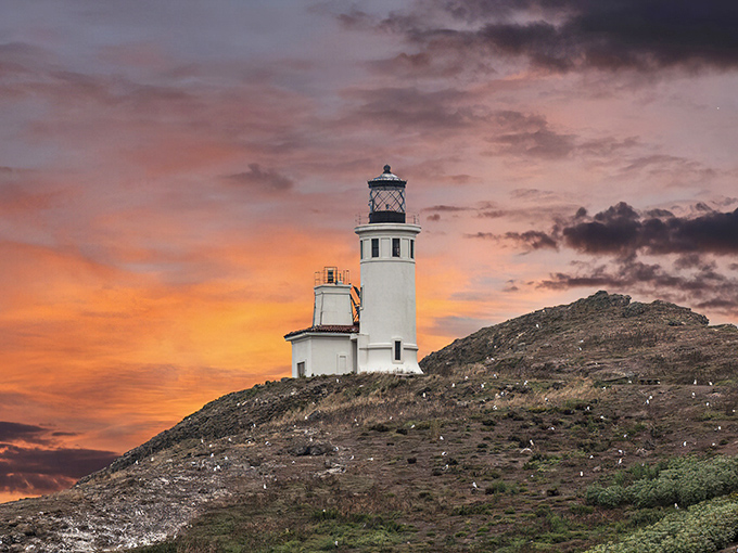 Nature's own light show frames the Anacapa Island Lighthouse in a sunset that makes even the most jaded Californian stop scrolling and stare.