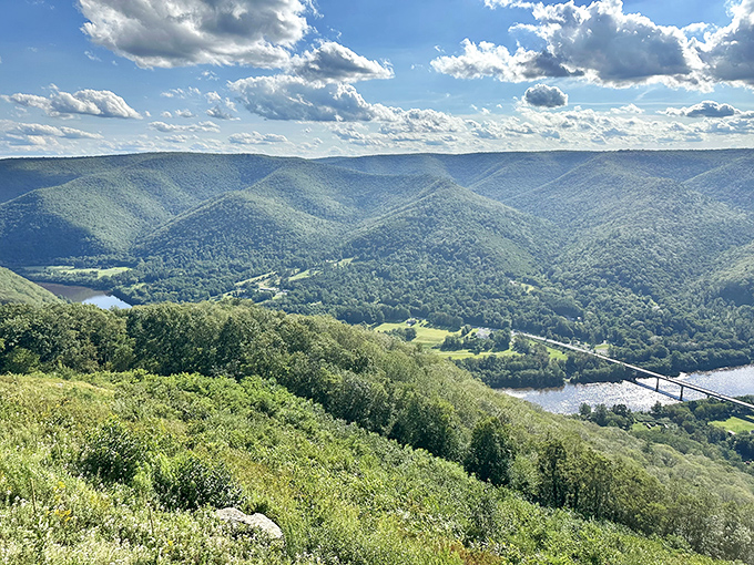 The rolling mountains of Pennsylvania unfold like nature's own masterpiece, with the Susquehanna River cutting a blue ribbon through endless green valleys.