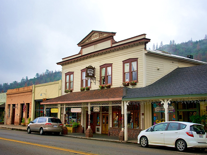 Historic storefronts stand like dignified elders watching over a main street that refuses to rush anywhere.