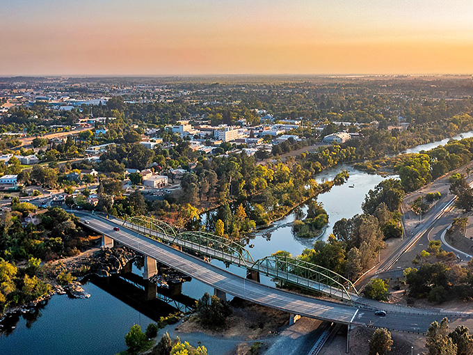 Sunset paints Oroville in golden hues as the Feather River winds through town. California retirement dreams without coastal price tags.