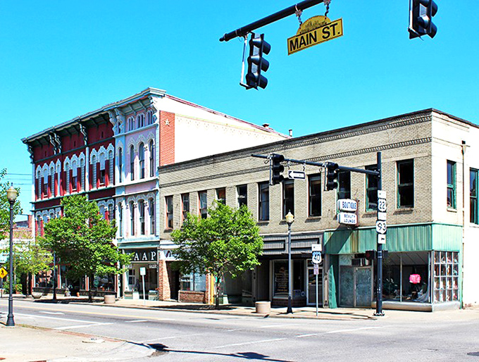 Main Street Zanesville offers a perfect snapshot of small-town Americana, where historic architecture meets modern life under those iconic hanging street signs.