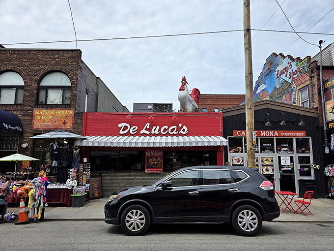 The bright red storefront of DeLuca's stands out like a beacon of breakfast hope on Penn Avenue, promising culinary salvation to hungry Strip District wanderers.