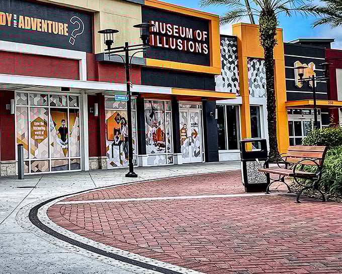 The vibrant orange and black fa&ccedil;ade of Museum of Illusions Orlando stands out at ICON Park like a magic trick waiting to happen.