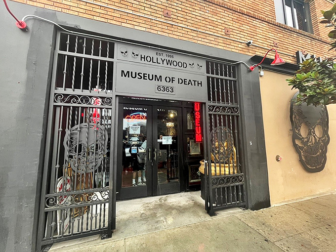 The unassuming facade of Hollywood's Museum of Death welcomes the brave with wrought iron gates and skull motifs. Not your typical tourist attraction!