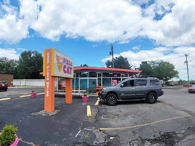 The bright orange exterior of Pizza Cat stands out like a beacon of culinary adventure in Toledo, promising pizza experiences that color outside the traditional lines.
