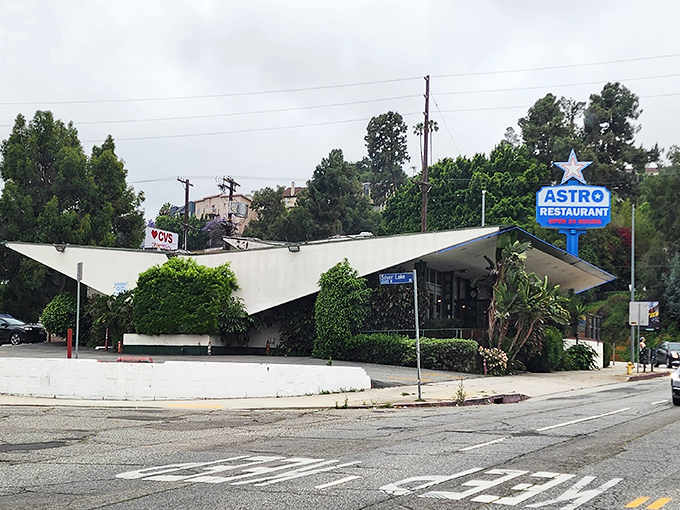 Astro's distinctive Googie architecture stands out against the Silver Lake skyline, a retro-futuristic time capsule from California's space-age optimism.