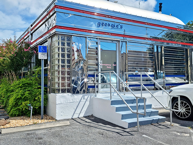 The gleaming silver exterior of Georgie's Diner shines like a beacon of breakfast hope in St. Augustine, complete with classic glass block windows and retro charm.